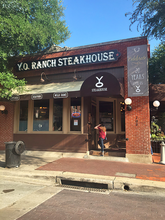 The brick facade of Y.O. Ranch Steakhouse beckons carnivores to Dallas' historic West End like a meaty lighthouse guiding hungry ships to shore.