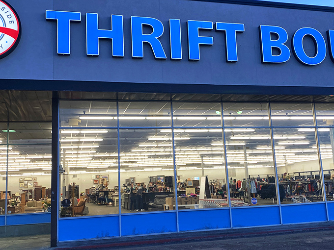 The blue sign beckons like a siren call to treasure hunters. This unassuming storefront in Millcreek hides a universe of possibilities inside.