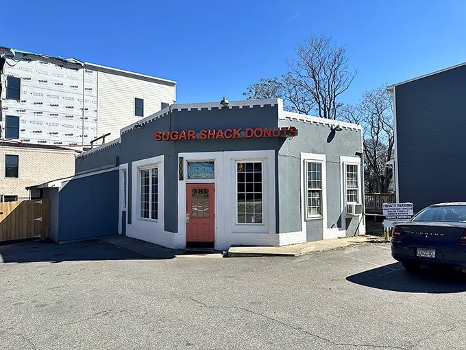 That iconic orange door isn't just an entrance&mdash;it's a portal to donut nirvana. The unassuming gray exterior hides Richmond's sweetest secret.