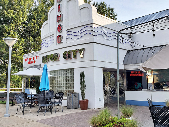 Art deco meets comfort food heaven in this retro-styled exterior. The blue awnings and vintage signage promise a time-traveling culinary adventure. 