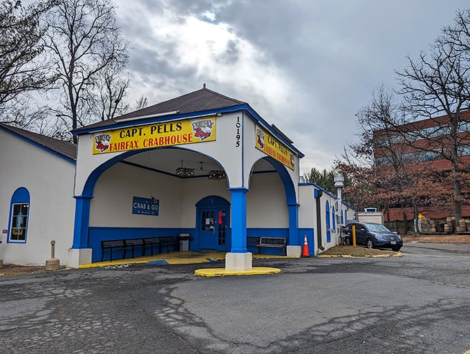 The blue and white exterior of Captain Pell's stands like a maritime beacon in suburban Fairfax, promising seafood treasures within. No pretension, just delicious anticipation.