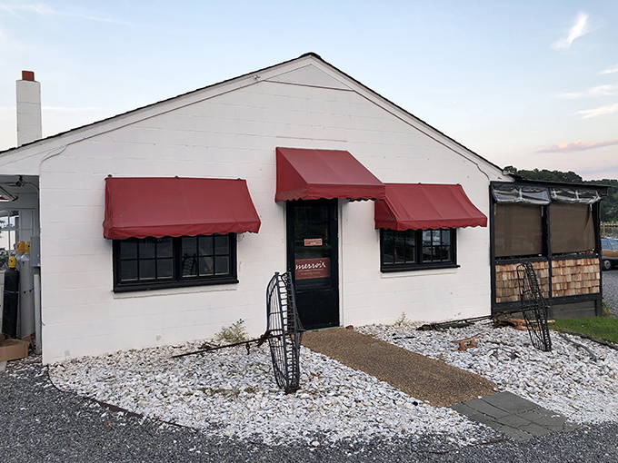 The entrance to seafood paradise - a humble wooden structure with bright orange awnings where Chesapeake Bay magic happens daily.