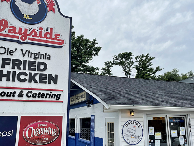 The unassuming white building with its iconic sign promises "Ole' Virginia Fried Chicken" &ndash; a beacon of hope for hungry travelers seeking authentic Southern comfort. 