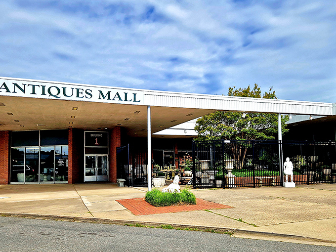 The unassuming brick exterior of West End Antiques Mall belies the wonderland of treasures waiting inside. Like a time-travel portal disguised as a 1970s department store.