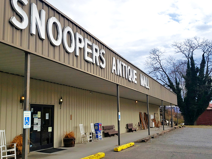 The unassuming exterior of Snoopers Antique belies the wonderland within. Like a treasure chest disguised as a toolshed, it patiently waits for curious explorers.