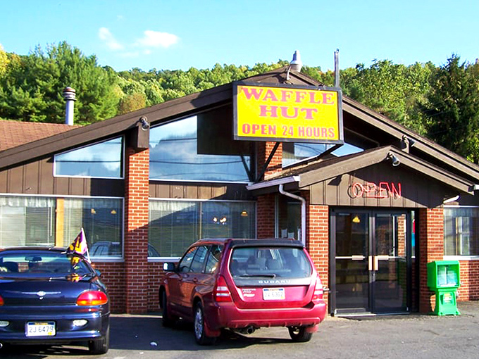 The modest sign says "WAFFLE HUT" but might as well read "Breakfast Paradise Ahead." Sometimes the most unassuming exteriors hide the greatest culinary treasures.