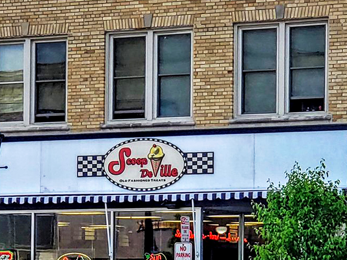 The classic checkered facade of Scoop De Ville stands like a time portal to simpler days when ice cream was the ultimate problem solver. 