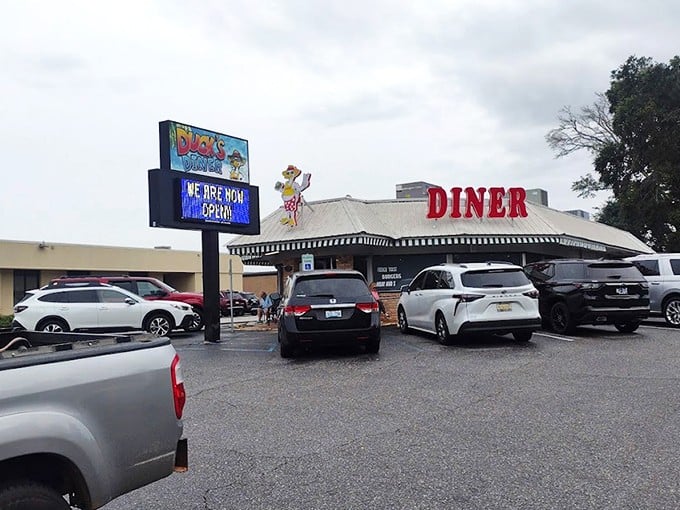 The bright red "DUCK'S" sign stands out like a breakfast lighthouse, guiding hungry souls to this Gulf Shores sanctuary of morning delights.