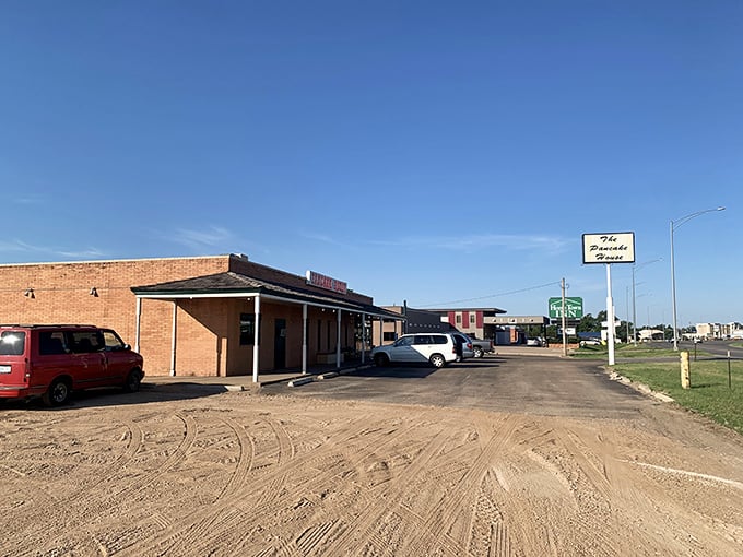 The unassuming exterior of The Pancake House in Liberal might not scream "culinary destination," but that parking lot full of locals tells the real story.