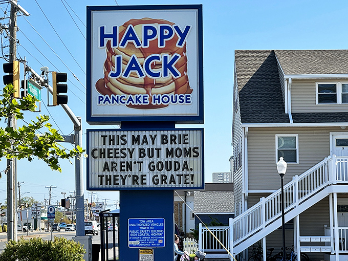 The iconic blue and orange sign beckons hungry beachgoers with its promise of pancake perfection and the bonus of dad jokes that are so bad they're good.