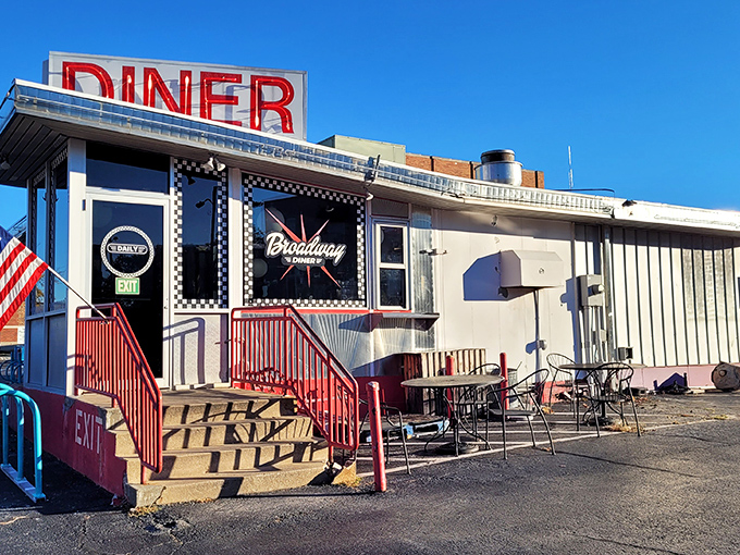 The classic checkerboard trim instantly telegraphs "authentic diner experience ahead" &ndash; a roadside beacon promising comfort food and conversation in equal measure. 