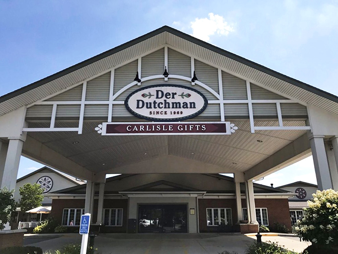 The welcoming facade of Der Dutchman stands like a beacon of comfort food in Plain City, with its charming porch and country-style architecture inviting hungry travelers inside.