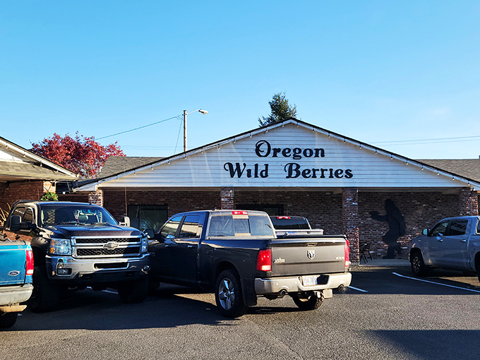 The brick-and-white exterior of Berry Patch Restaurant stands like a beacon of comfort food promise against Oregon's blue skies. 