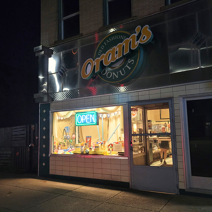 The green and gold storefront beckons like a lighthouse for the sugar-deprived. Since 1938, this humble facade has witnessed countless donut pilgrimages. 