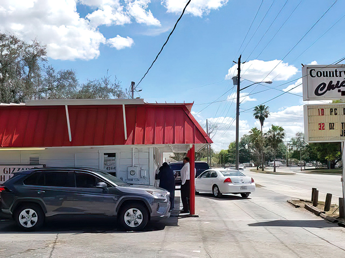 The iconic red-roofed shack draws a steady line of locals who know that culinary treasures often hide in the most unassuming packages.