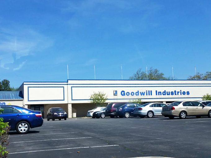 The iconic blue and white facade of Goodwill Industries on Kingston Pike stands like a beacon for treasure hunters across Knoxville, promising adventures in secondhand splendor.