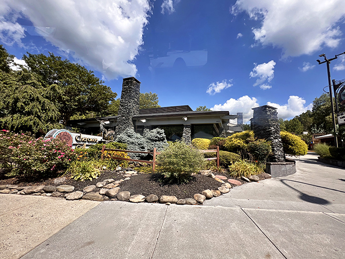 The mountain lodge architecture of Cherokee Grill welcomes you like a warm hug, with stacked stone and timber beams promising rustic elegance inside.