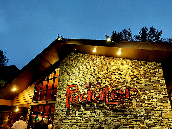 The rustic stone and timber exterior of The Peddler Steakhouse blends perfectly with its Smoky Mountain surroundings, like a carnivore's cabin in the woods.