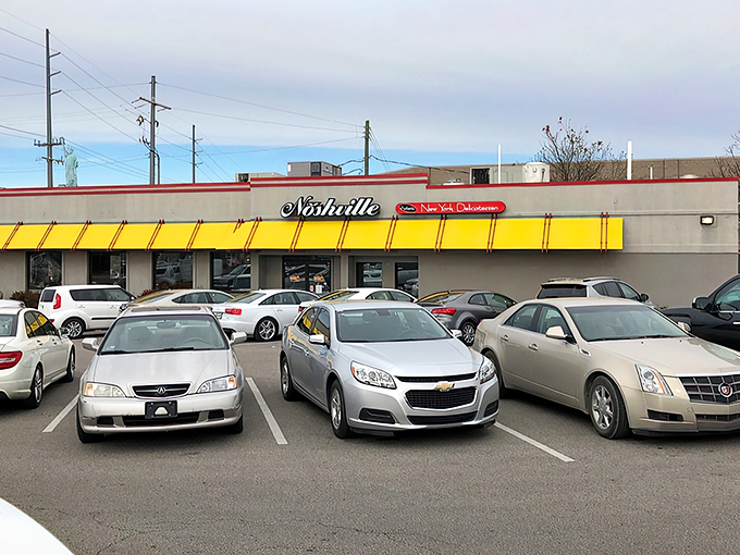 That iconic yellow awning isn't just a sunshade&mdash;it's a beacon of hope for sandwich lovers seeking refuge from Nashville's hot chicken monopoly.