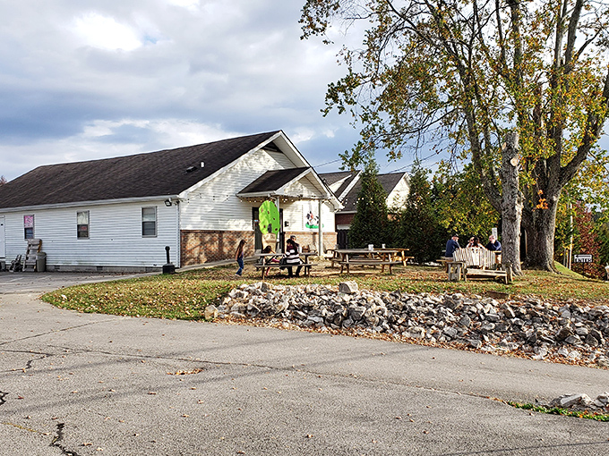 The unassuming white building with string lights and a cow logo promises more joy than most five-star restaurants I've visited.