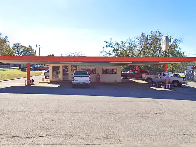 The unassuming exterior of K N Root Beer Drive In proves once again that Texas's greatest culinary treasures often hide in plain sight.