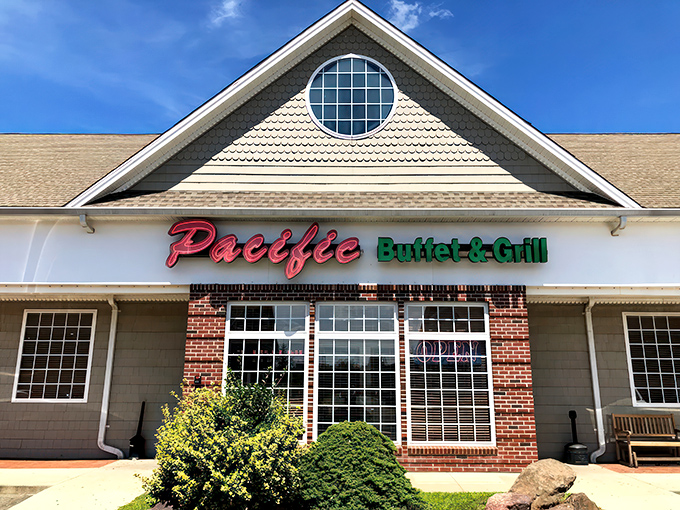 The red and green neon sign of Pacific Buffet & Grill beckons like a lighthouse for the hungry traveler navigating suburban Connecticut.