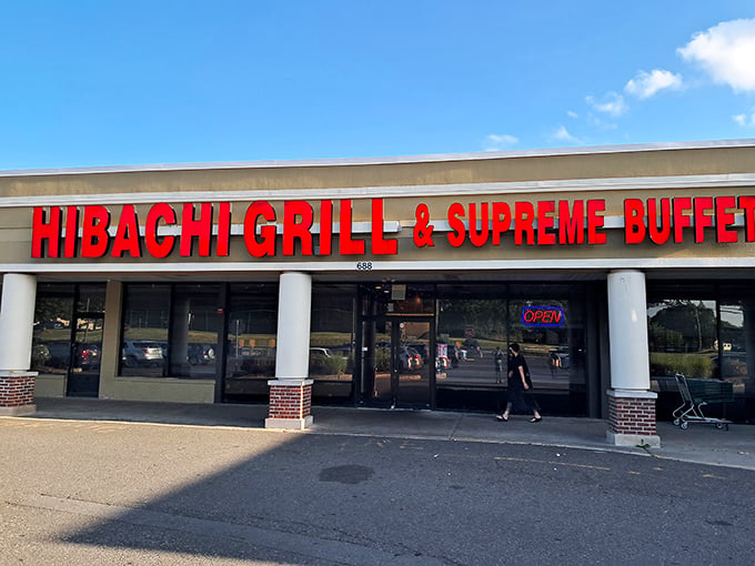The bright red signage acts like a beacon for hungry souls. Simple storefront, extraordinary promises of culinary abundance within.