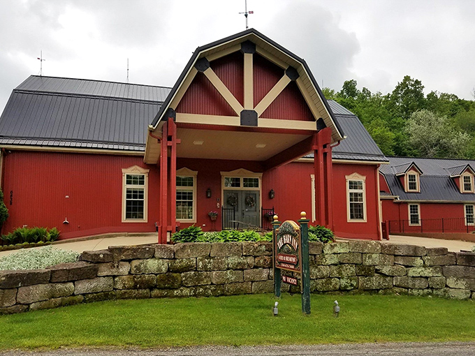 The iconic red exterior of The Barn Inn stands proudly against Ohio's countryside, like a beacon of comfort calling weary travelers home.