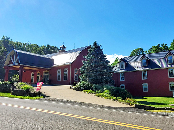The iconic red exterior of The Barn Inn stands proudly against Ohio's countryside, like a beacon of comfort calling weary travelers home.