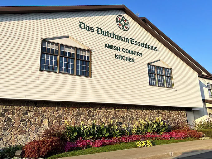 The classic white facade of Das Dutchman Essenhaus announces itself like a culinary lighthouse beckoning hungry travelers to the shores of comfort food paradise.
