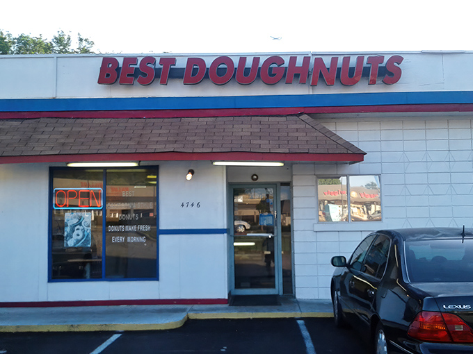 The unassuming white building with its bold red sign promises what lies within: donut perfection without pretension. Simplicity at its finest.