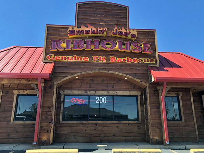The rustic wooden facade of Smokin' Joe's Ribhouse isn't trying to impress anyone&mdash;until you taste what's cooking inside. That red roof? Consider it a beacon for barbecue pilgrims.