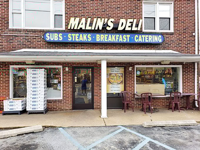The brick facade of Malin's Deli stands as a beacon of sandwich salvation in Newark, promising subs, steaks, breakfast, and catering to hungry Delaware residents.