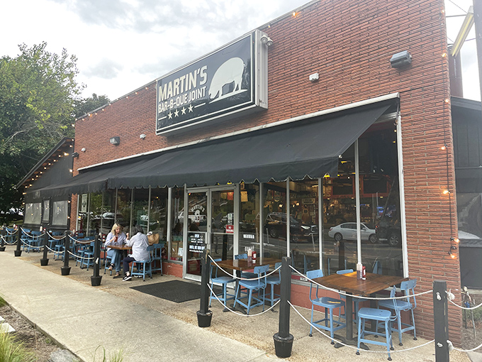 The red brick exterior of Martin's Bar-B-Que Joint beckons hungry pilgrims with its no-nonsense fa&ccedil;ade and the promise of smoky delights within.