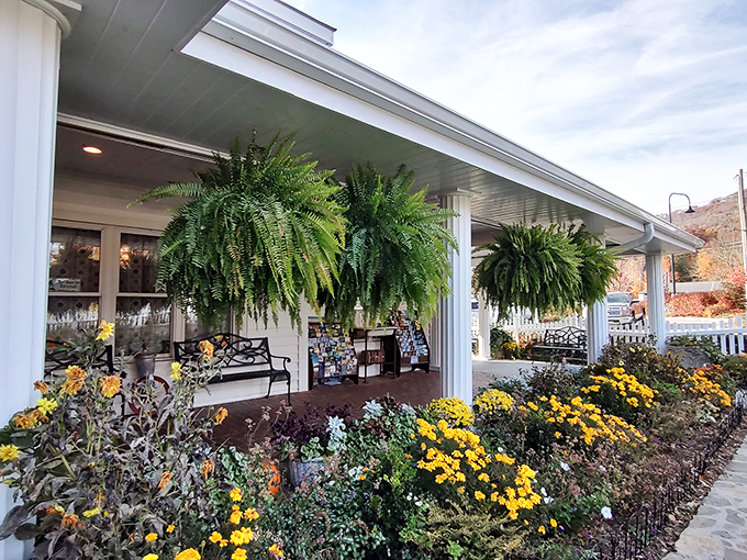 The charming white clapboard exterior of Dan'l Boone Inn welcomes visitors with a picket fence straight out of an American storybook.