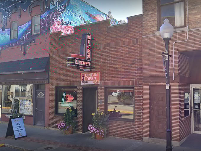 The iconic red brick corner building of Nick's Kitchen stands as a beacon of culinary history on Jefferson Street in downtown Huntington.