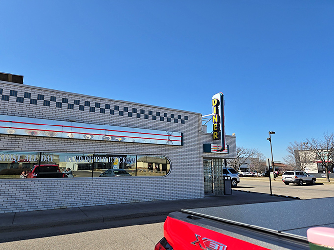 That classic white brick exterior with the checkerboard trim isn't just architecture&mdash;it's a promise of comfort food paradise waiting inside.