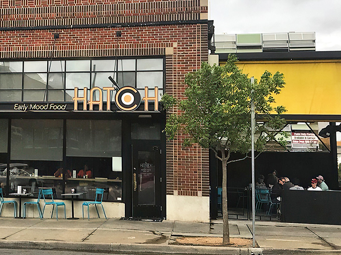 The sunny yellow exterior of Hatch announces its presence like a breakfast beacon, complete with that iconic egg-in-the-O logo.