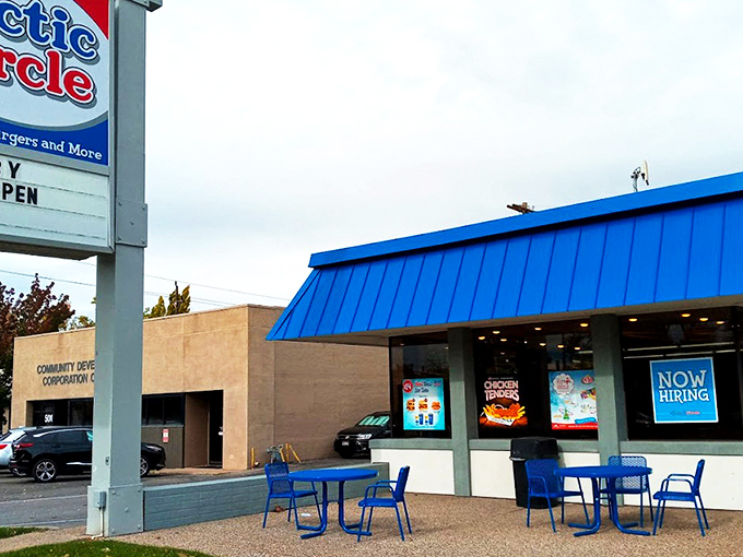 The iconic blue roof of Arctic Circle stands like a beacon of comfort food against the Utah sky, promising fry sauce nirvana within.