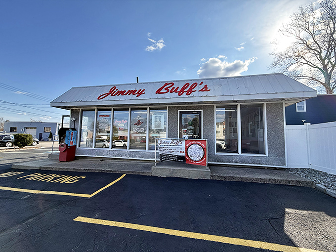 The iconic Jimmy Buff's sign stands sentinel against a perfect blue New Jersey sky, promising Italian hot dog perfection to all who approach.
