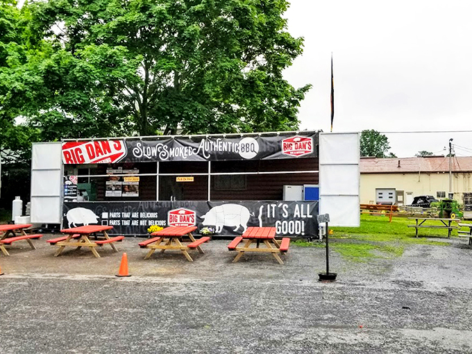 The rustic exterior of Big Dan's BBQ promises smoky treasures within. Red picnic tables invite you to dive into Pennsylvania's answer to Southern barbecue royalty.