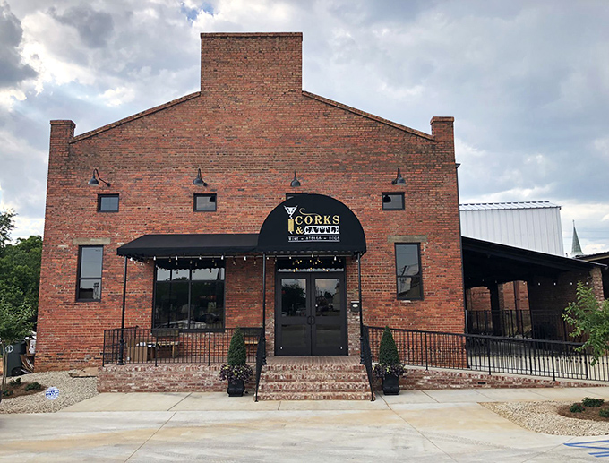 The warm glow of this historic brick building beckons like a lighthouse for hungry souls. Enterprise's best-kept secret stands proudly against the Alabama sky.