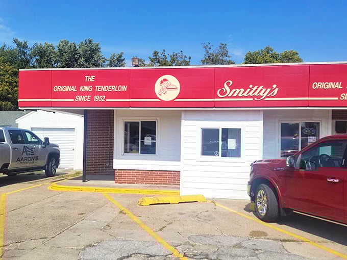 The bright red awning of Smitty's proudly announces "The Original King Tenderloin Since 1952"&mdash;a culinary landmark that's been perfecting pork longer than most of us have been eating it.