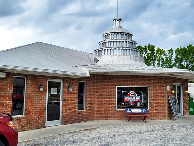 The humble exterior of Skylight Inn BBQ belies the culinary treasures within. No fancy frills needed when the smoke signals speak for themselves.