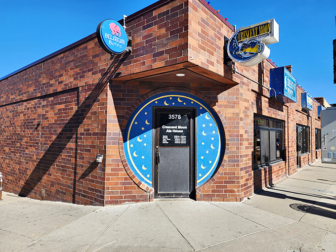 The brick exterior of Crescent Moon beckons like a culinary lighthouse, its blue moon sign promising delicious adventures within Omaha's Blackstone District.