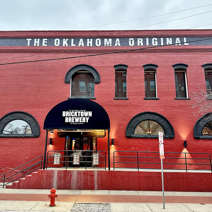 The iconic red brick exterior of Bricktown Brewery stands as a beacon of culinary promise in Oklahoma City's historic district, where industrial charm meets modern appetite.
