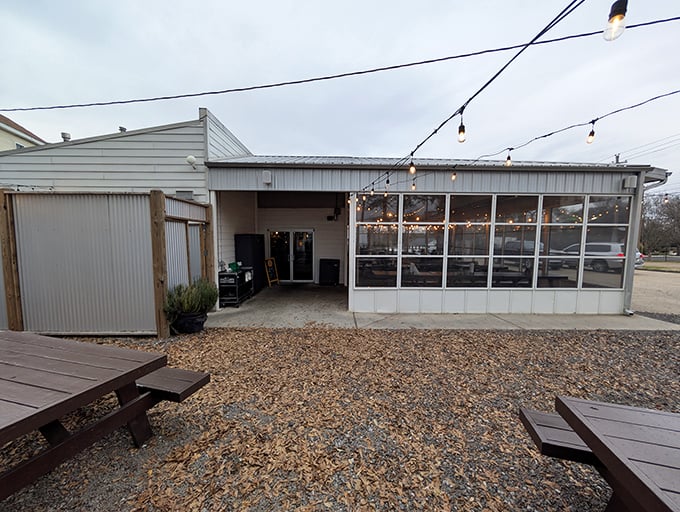 The Pig & Pint's inviting exterior glows at dusk, beckoning hungry travelers like a barbecue lighthouse in Jackson's hip Fondren district.