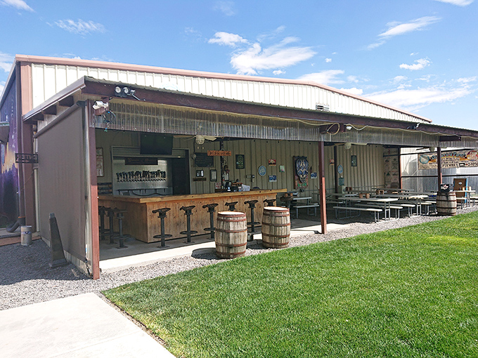 The ultimate "don't judge a book by its cover" moment. This unassuming metal building houses liquid gold under that brilliant New Mexico sky.