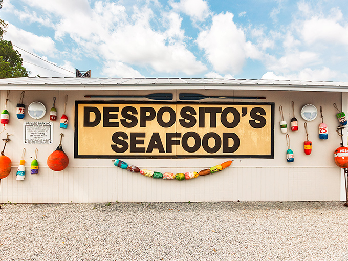 The unassuming white building with that bold red sign might fool you, but locals know&mdash;seafood paradise awaits inside this coastal gem.