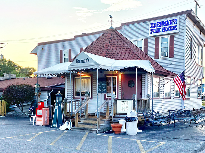 The iconic red-roofed entrance to Brennan's Fish House stands like a lighthouse beacon for hungry travelers. Seafood salvation awaits inside.